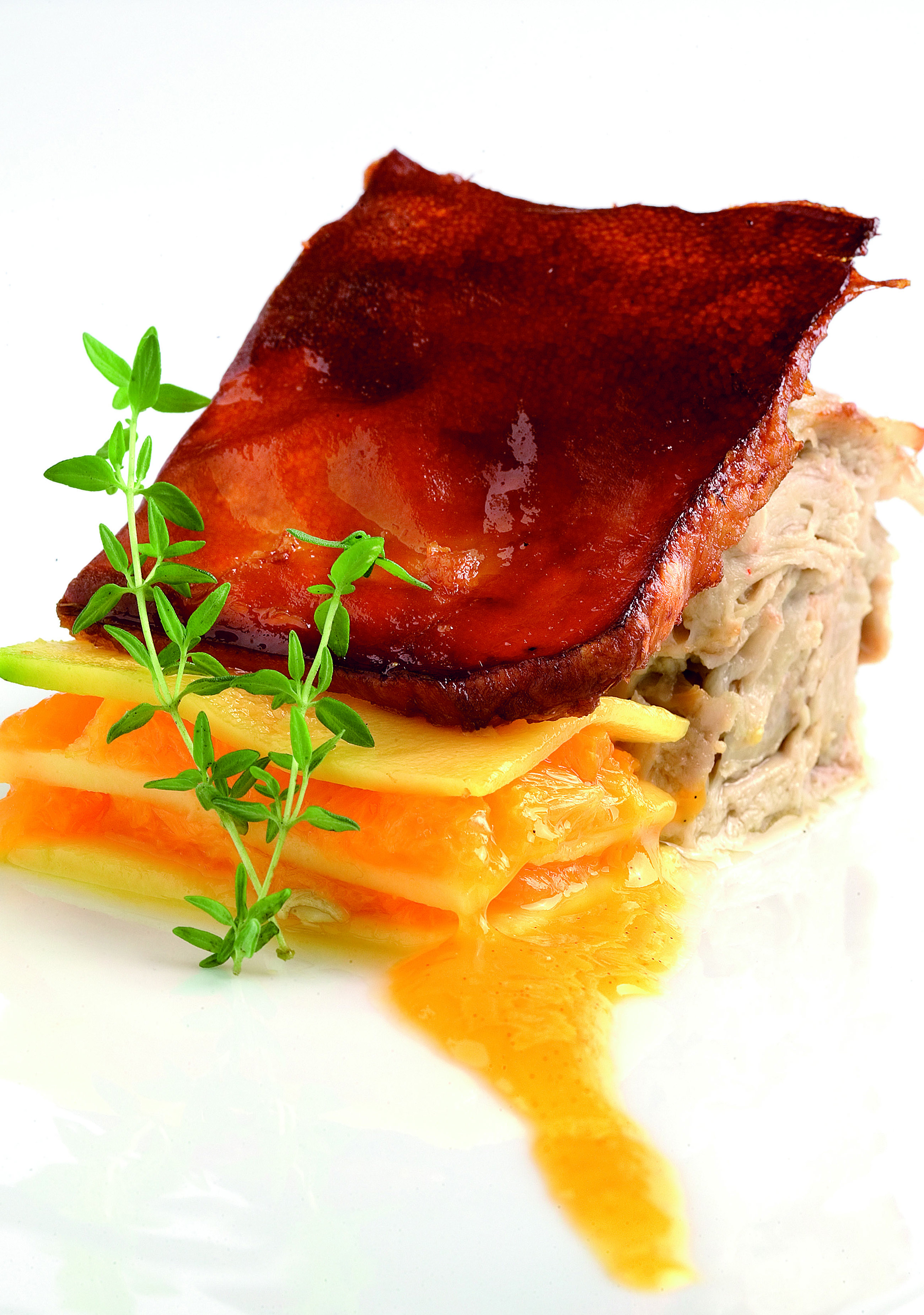 Lechón ibérico con mango y naranja